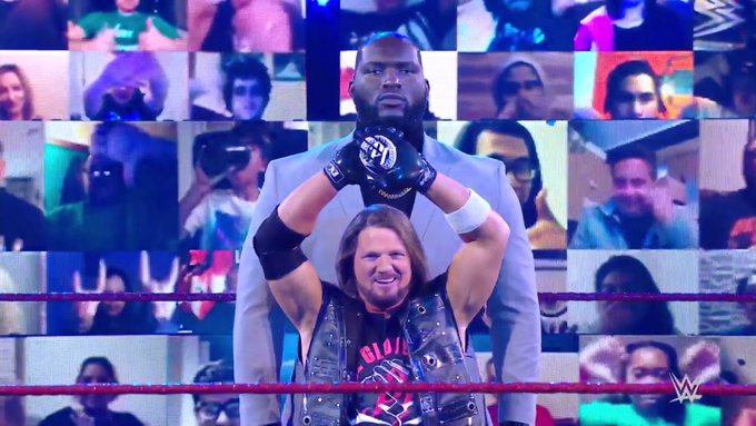 Jordan Omogbehin working as AJ Styles' bodyguard