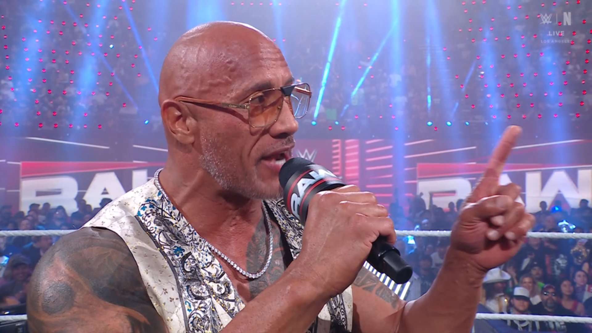 The Rock arrives for WWE Raw on Netflix debut; embraces Ari Emanuel ...