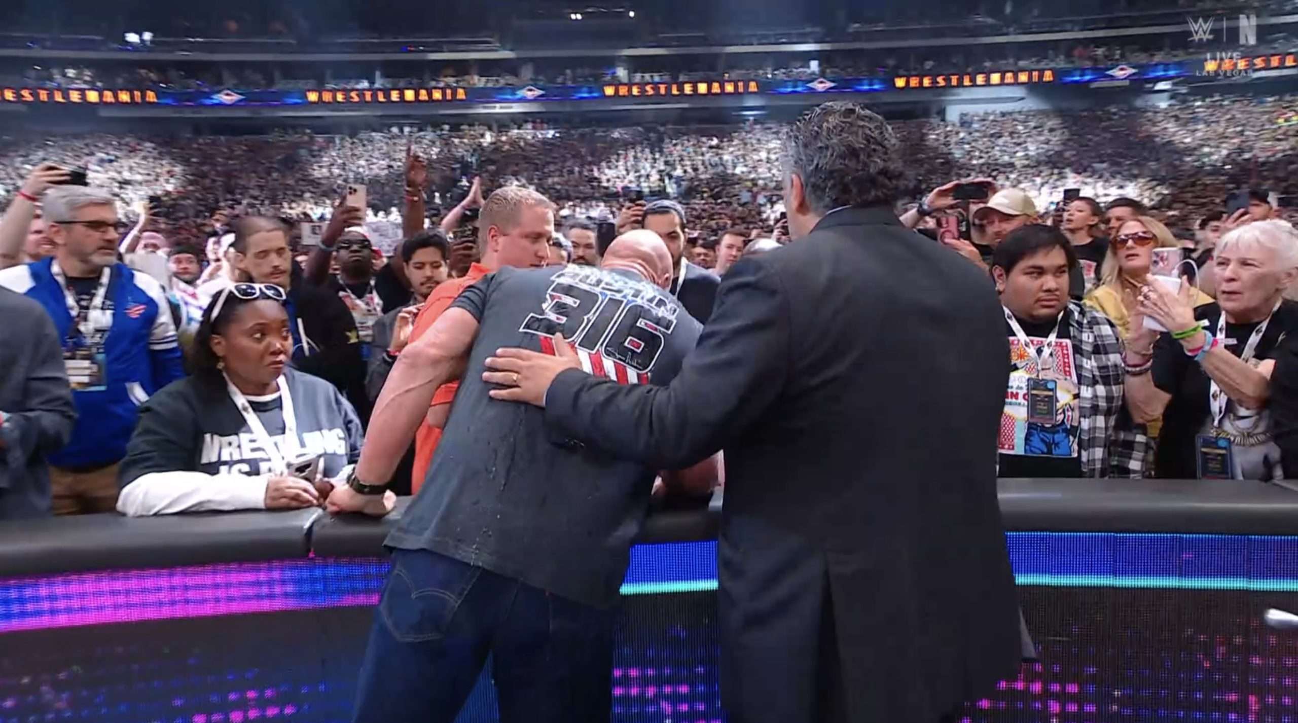 Steve Austin and WWE President Nick Khan speak to fan after Austin hits ...
