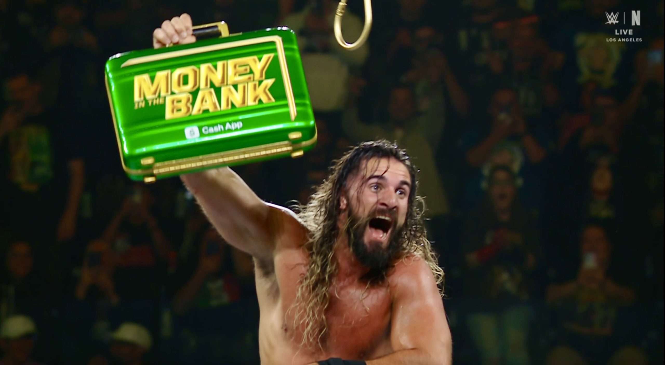 Seth Rollins captures the men’s Money in the Bank briefcase as Jacob ...